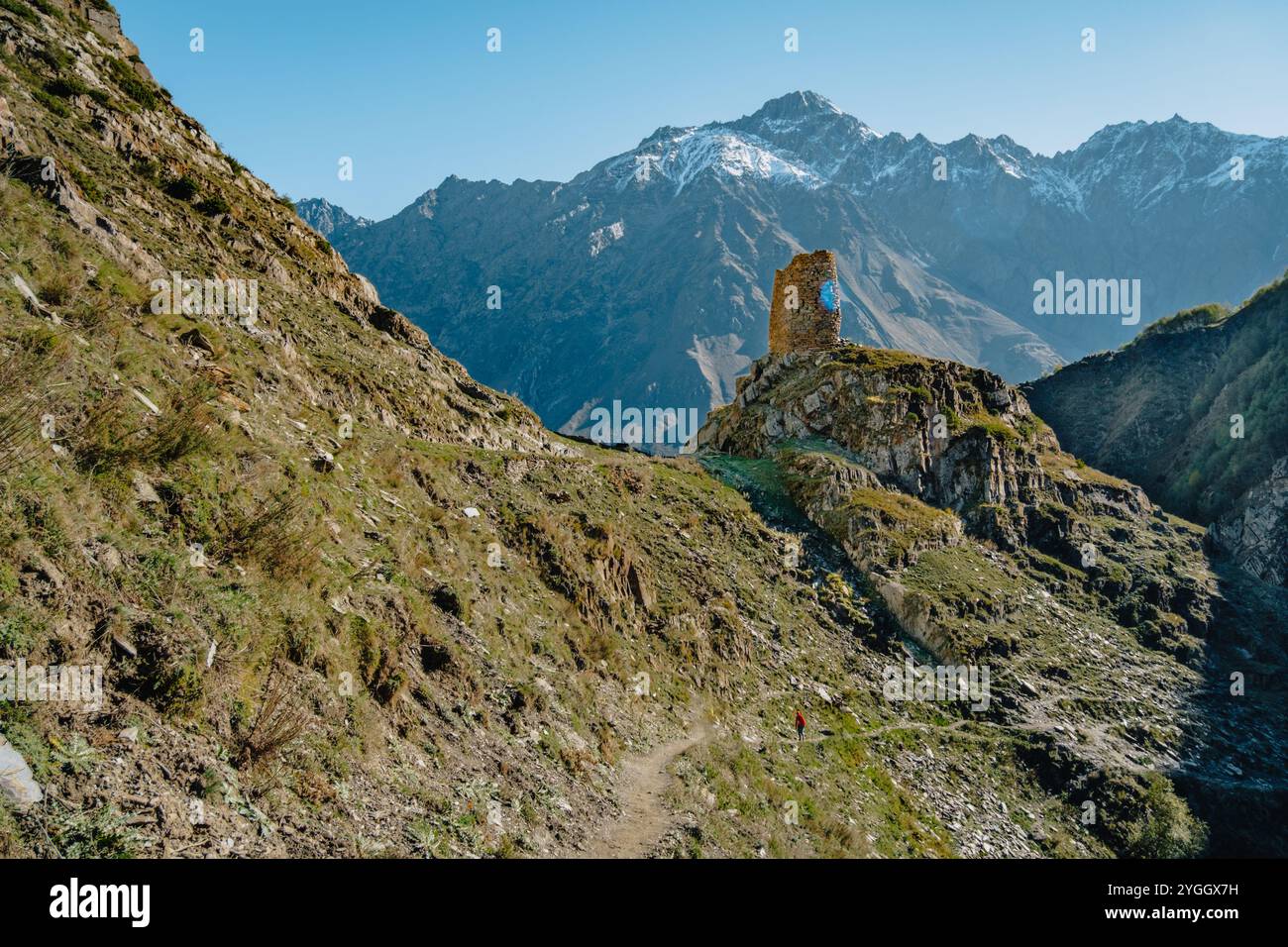 View on Gergeti medieval watchtower with the snow covered Mount Kuro in ...
