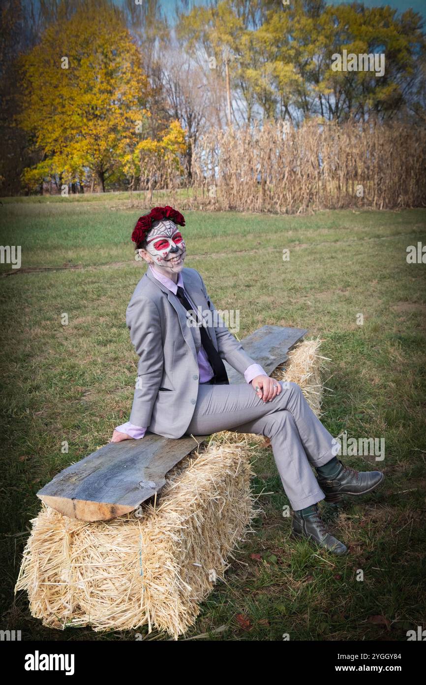 Portrait of a woman wearing a typical Day of the Dead mask at a Santa ...