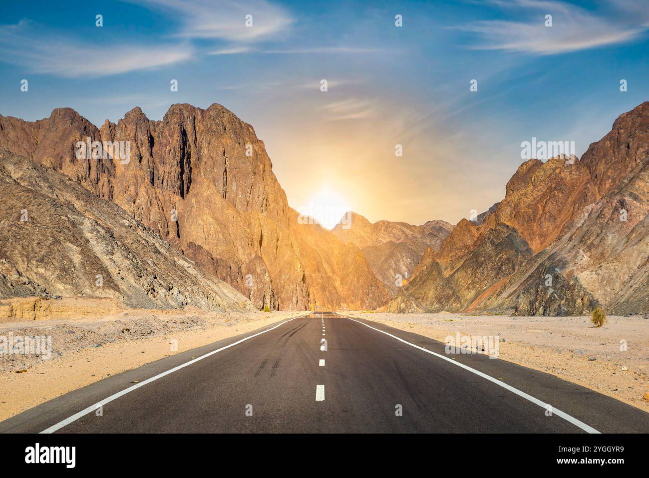 Asphalted road in egyptian mountains at sunset Stock Photo - Alamy