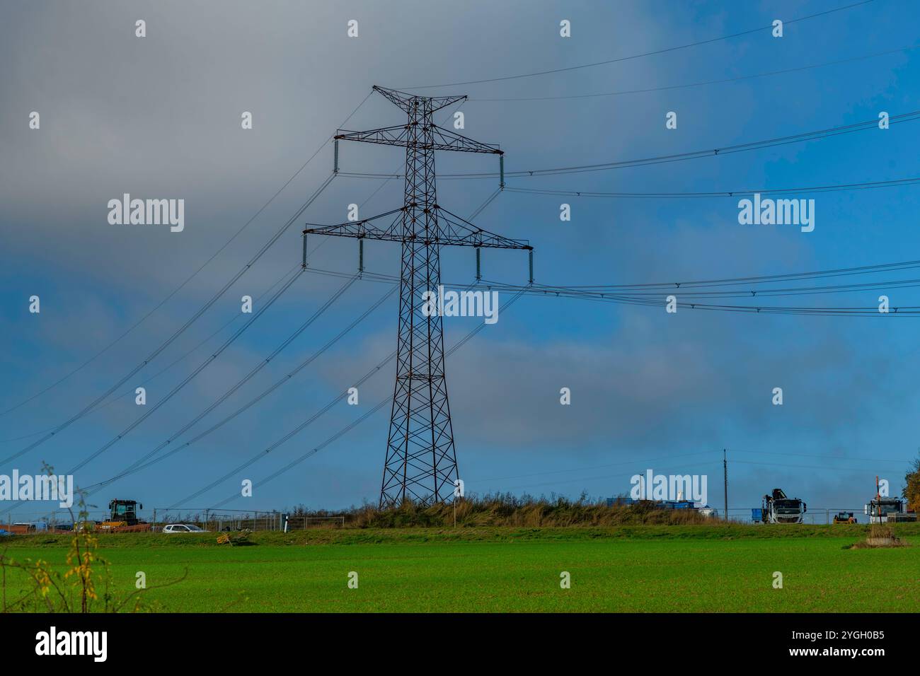 High voltage electric post wire near construction of new highway in ...