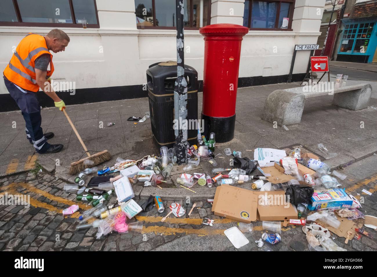 England, Kent, Margate, The Old Town, Cleaner Sweeping up Garbage on ...