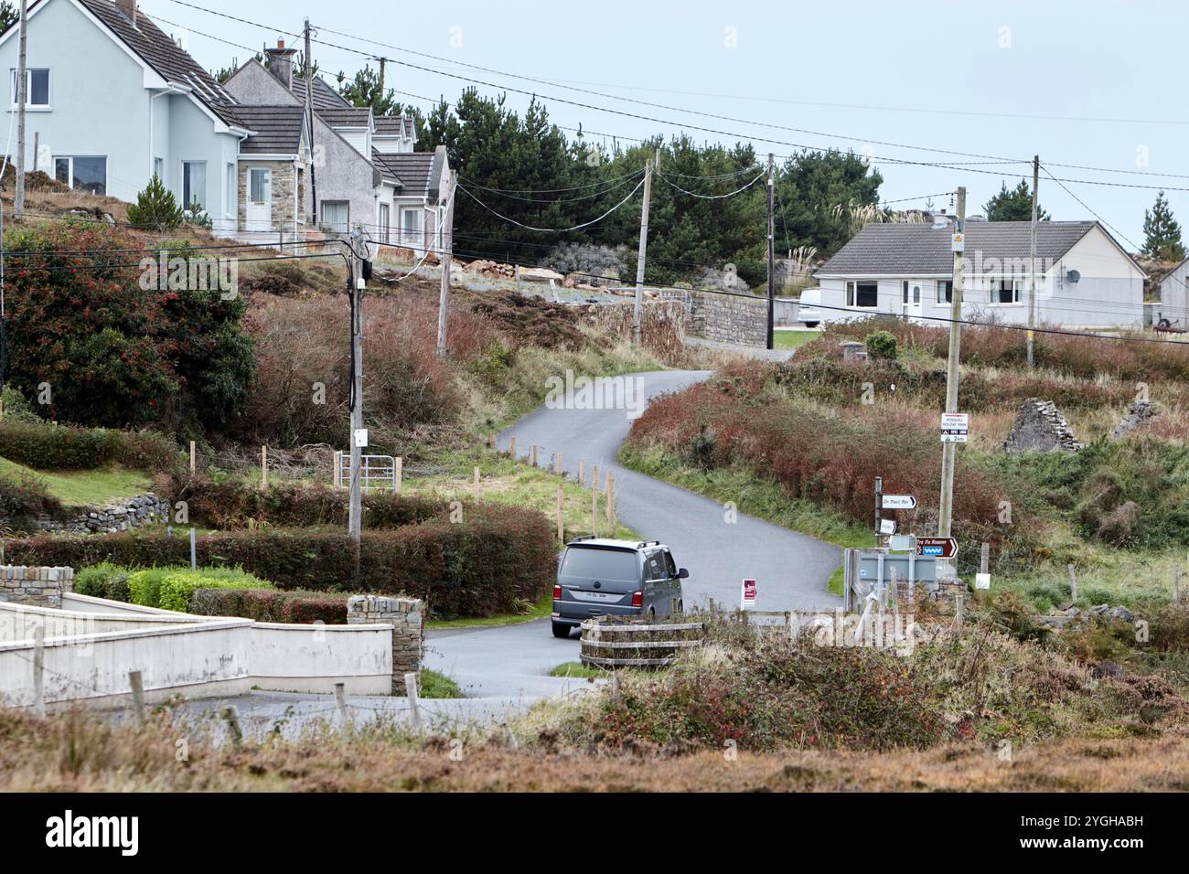 small narrow road through houses altaheeran rosguill peninsula, county ...