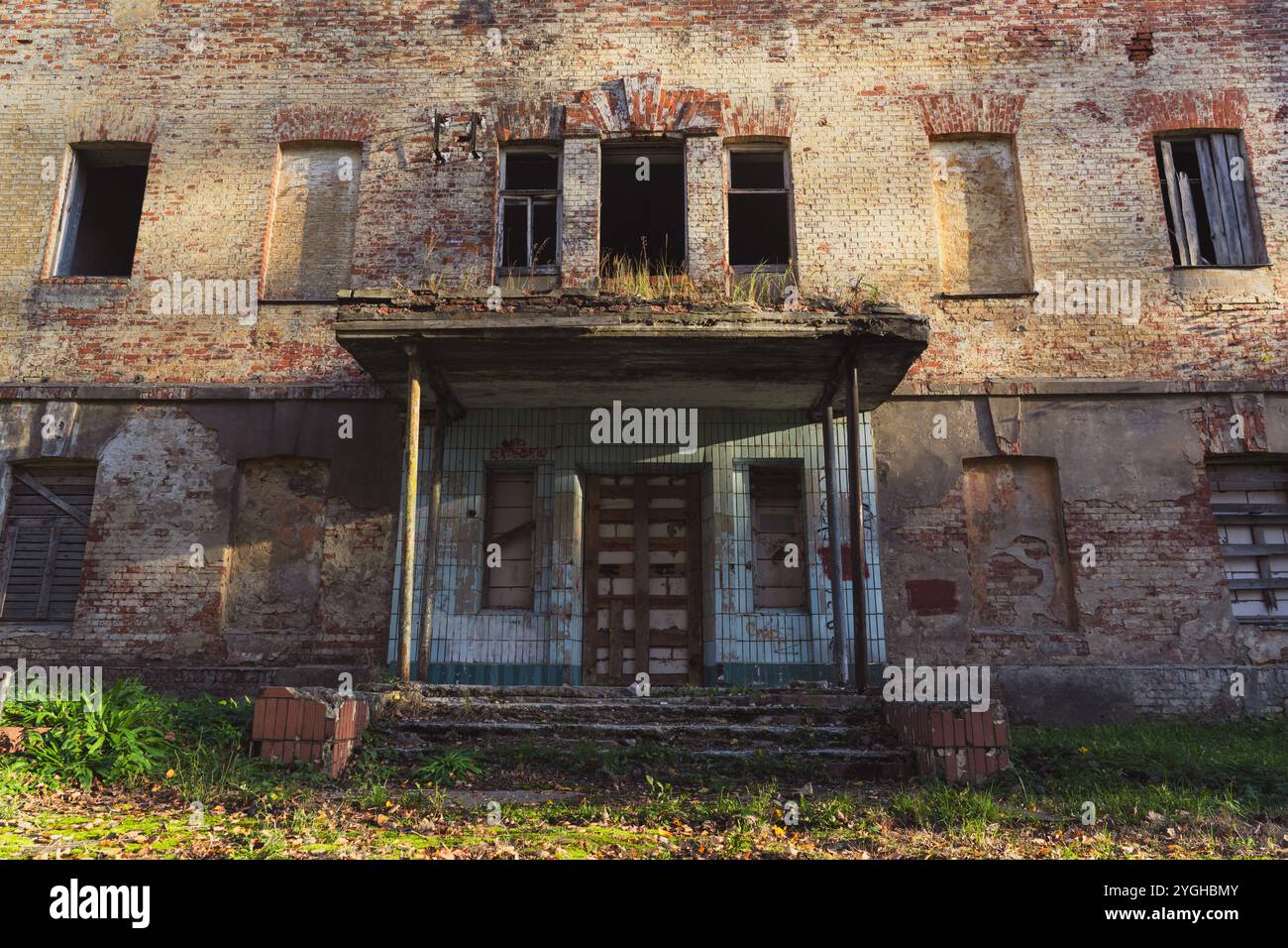 The entrance of an old, abandoned building without doors. The doorway ...