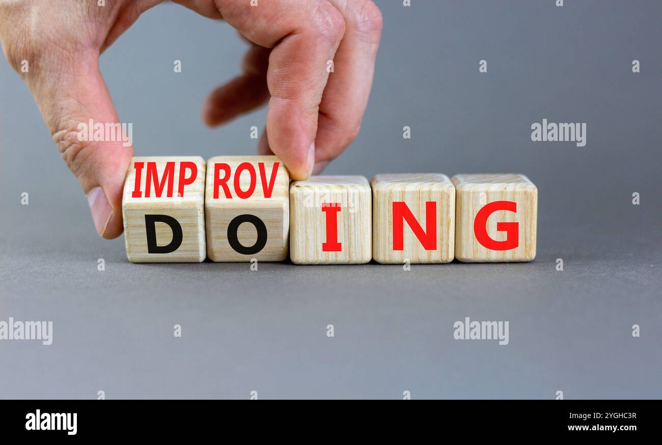 Doing or improving symbol. Businessman turns wooden cubes and changes ...