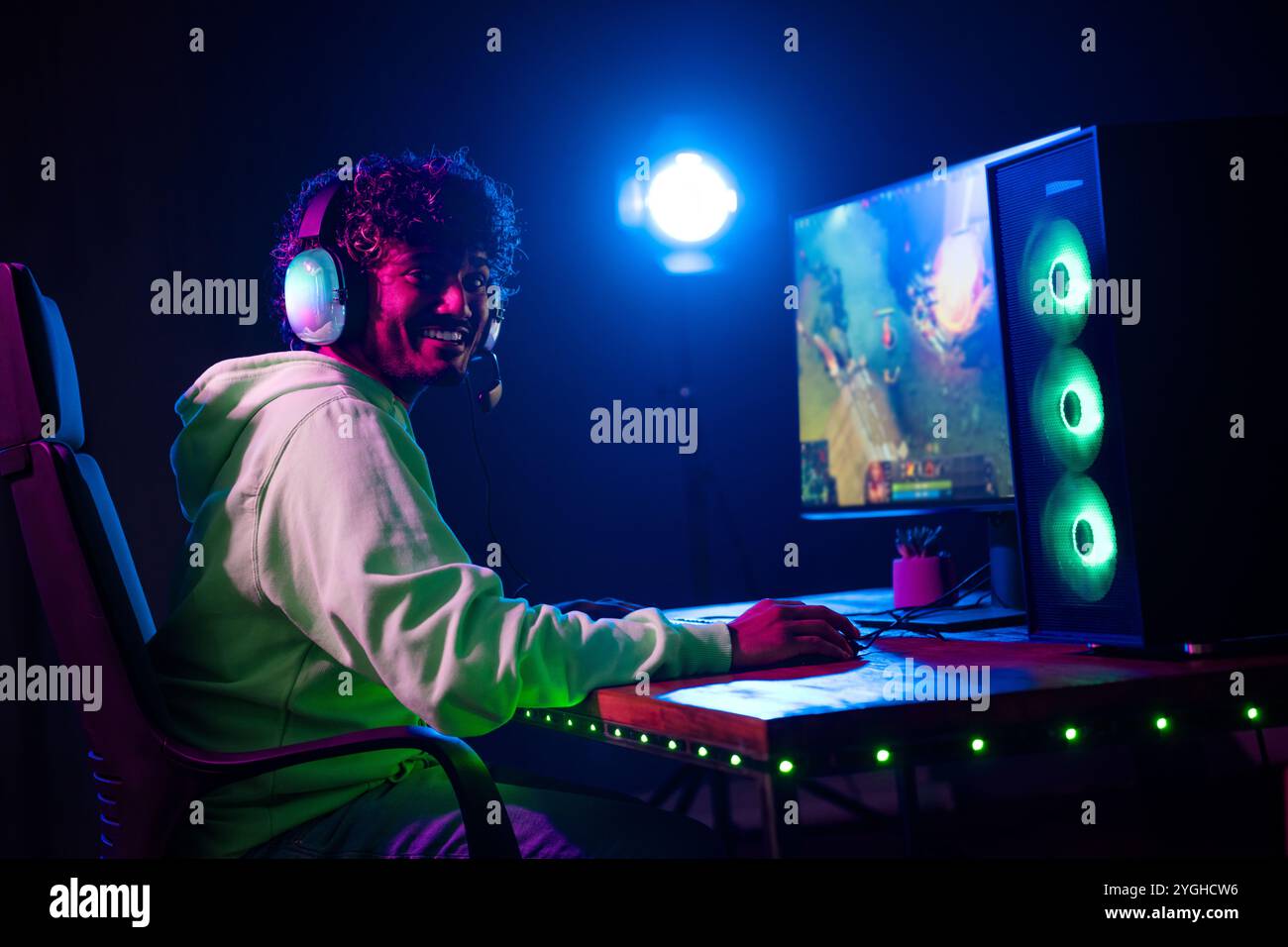 Photo of nice young male cheerful gamer play computer strategy game ...