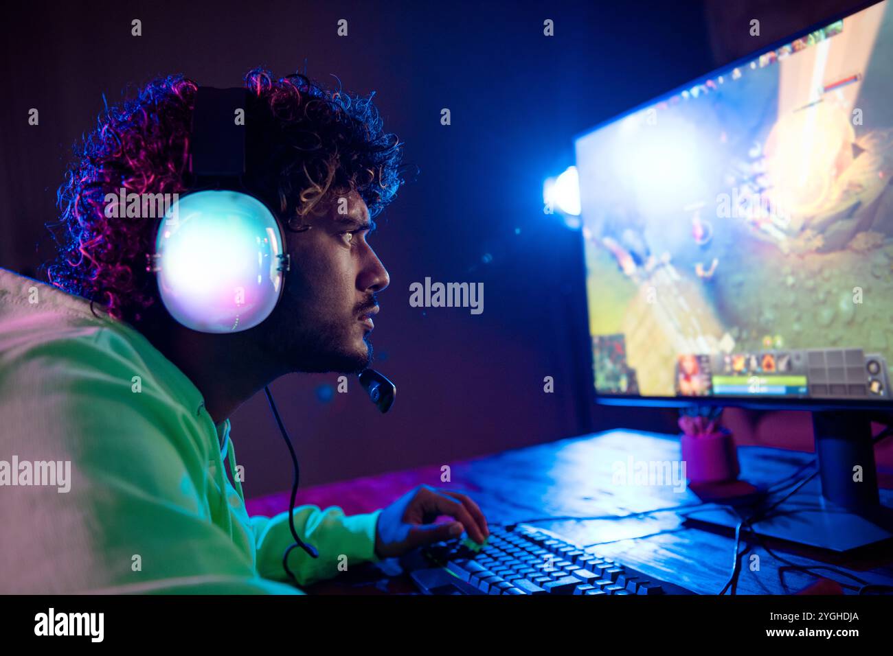 Photo of cute young guy stressed losing game play gamer computer purple ...