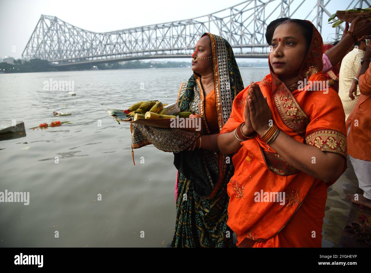 Hindu devotees praying during a ritual for Sun god at Ganga Ghat on the ...