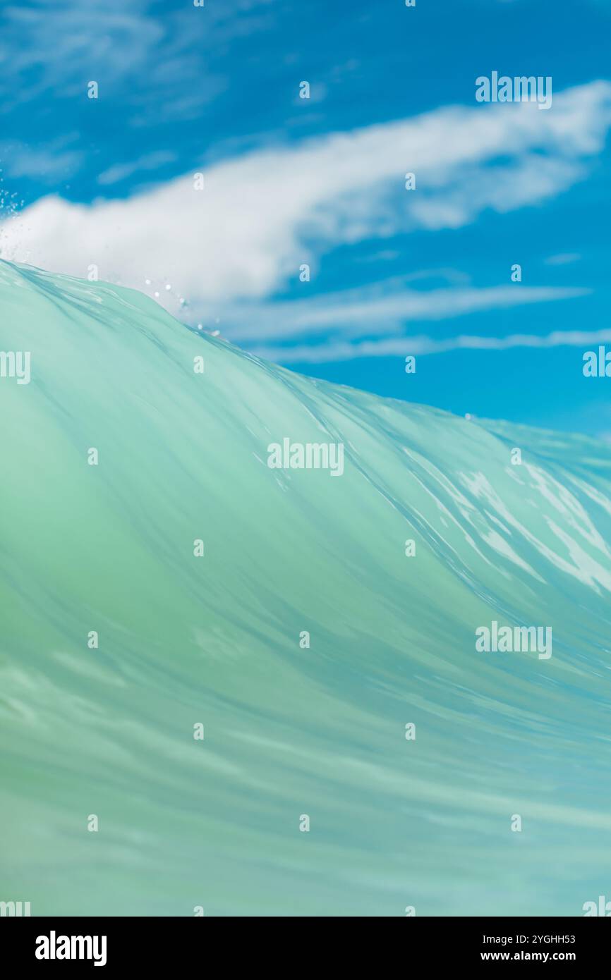 Capturing the majestic curl of a barreling wave at Sandy Beach, East ...