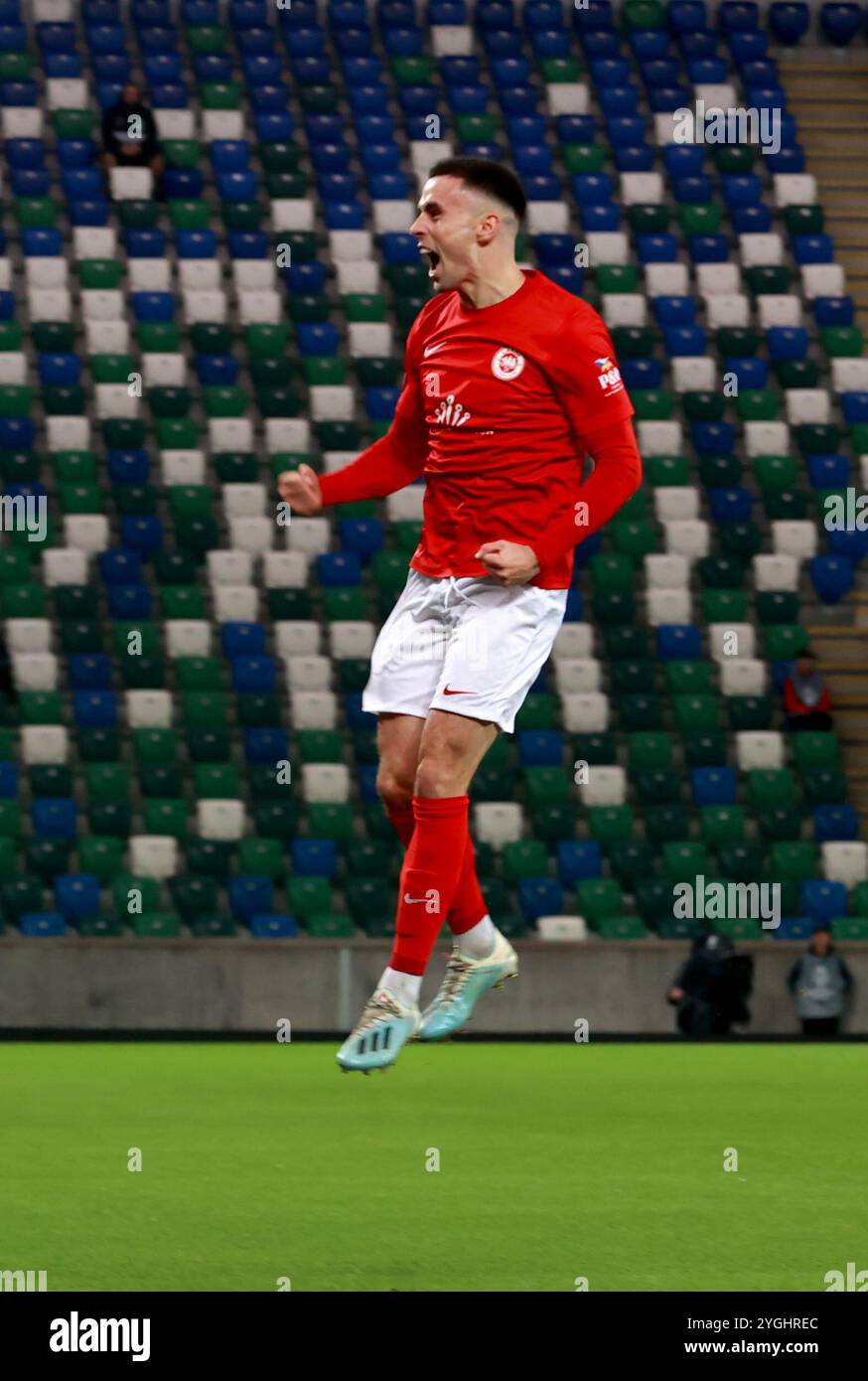 Larne's Jordan McEneff celebrates their side's first goal of the game ...