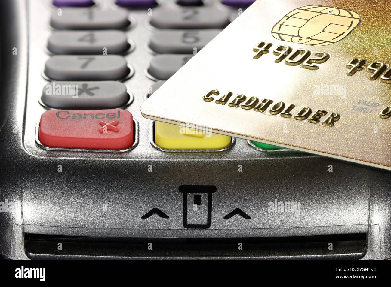 gold status bank or loyalty card held over payment terminal Stock Photo ...