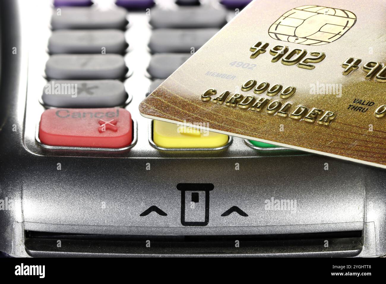 gold status bank or loyalty card held over payment terminal Stock Photo ...