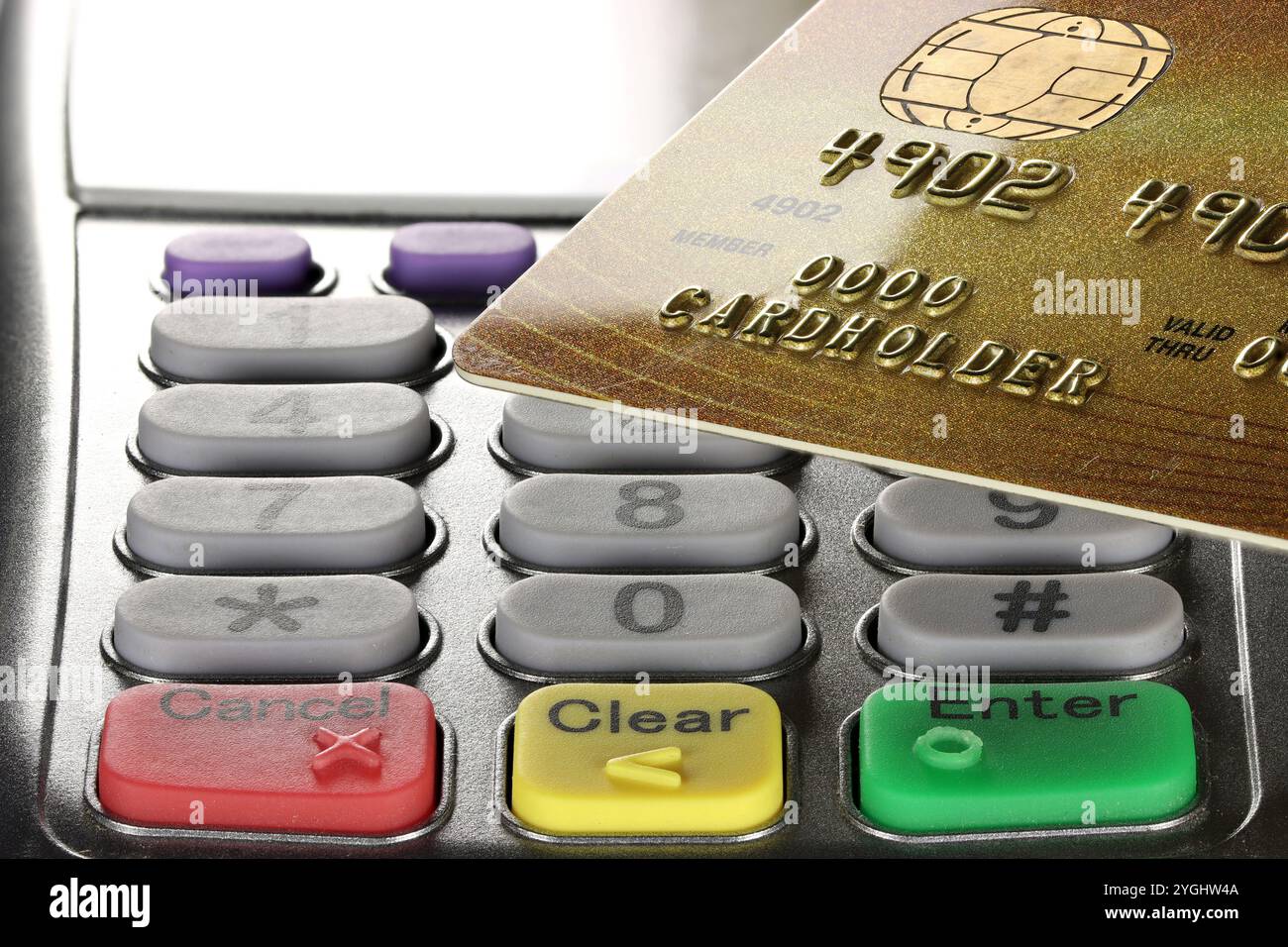 gold status bank or loyalty card held over payment terminal Stock Photo ...
