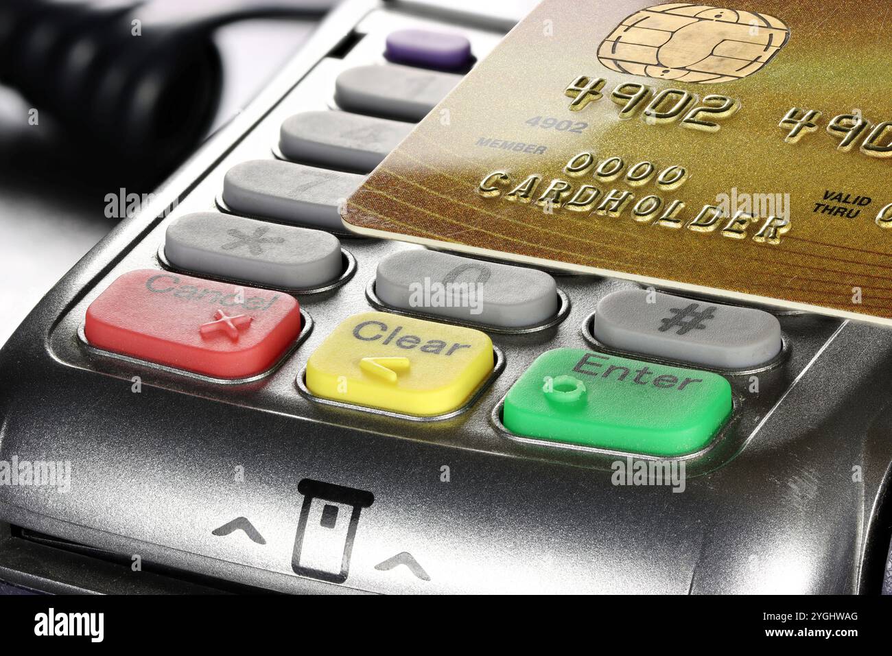 gold status bank or loyalty card held over payment terminal Stock Photo ...