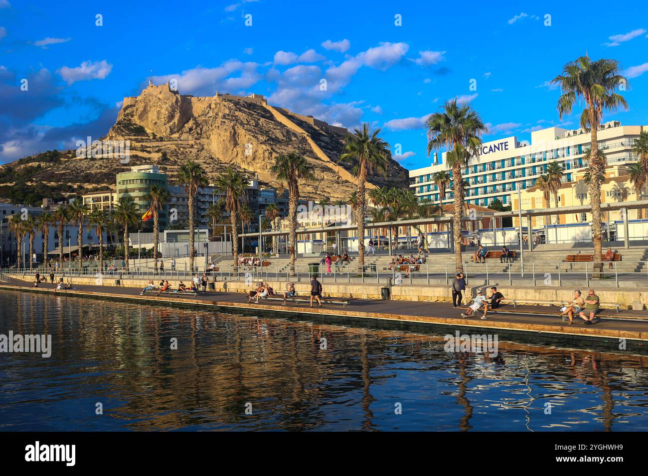 Alicante, Spain, 07th November, 2024: People sitting on benches ...