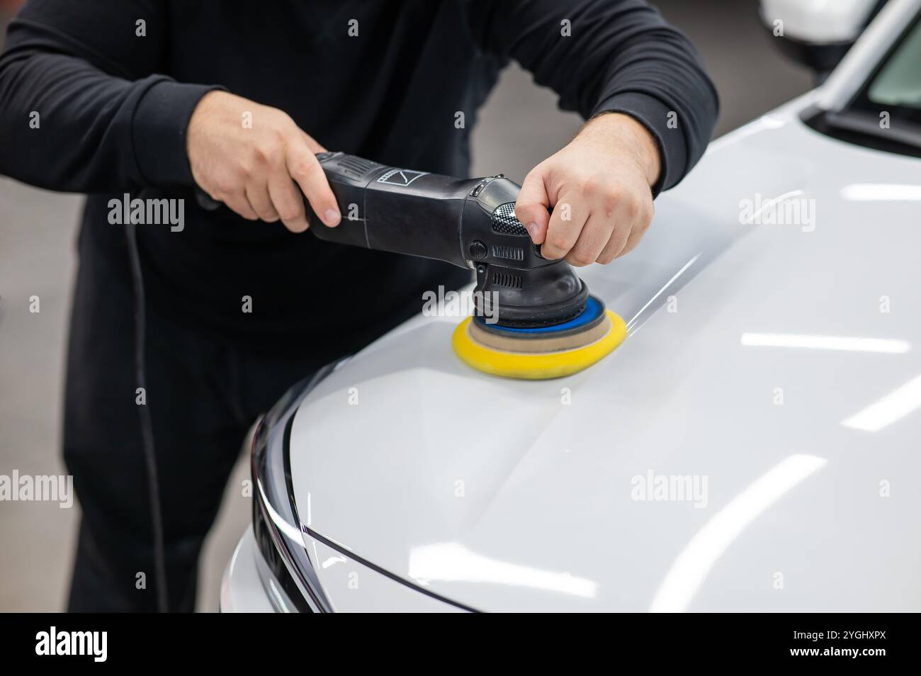 Process of polishing white car hood surface using orbital polishing ...