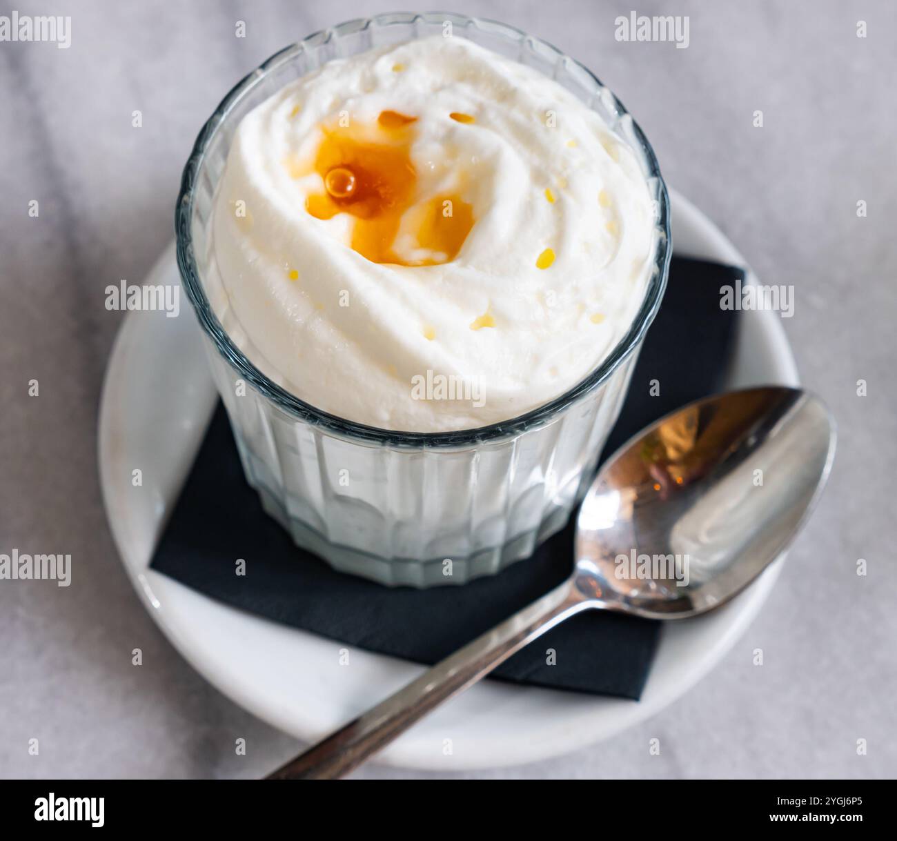 Sweet milk mousse made from yogurt with honey Stock Photo - Alamy