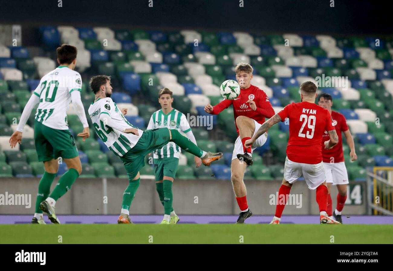 St. Gallen's Mihailo Stevanovic (centre left) and Larne's Dylan Sloan ...