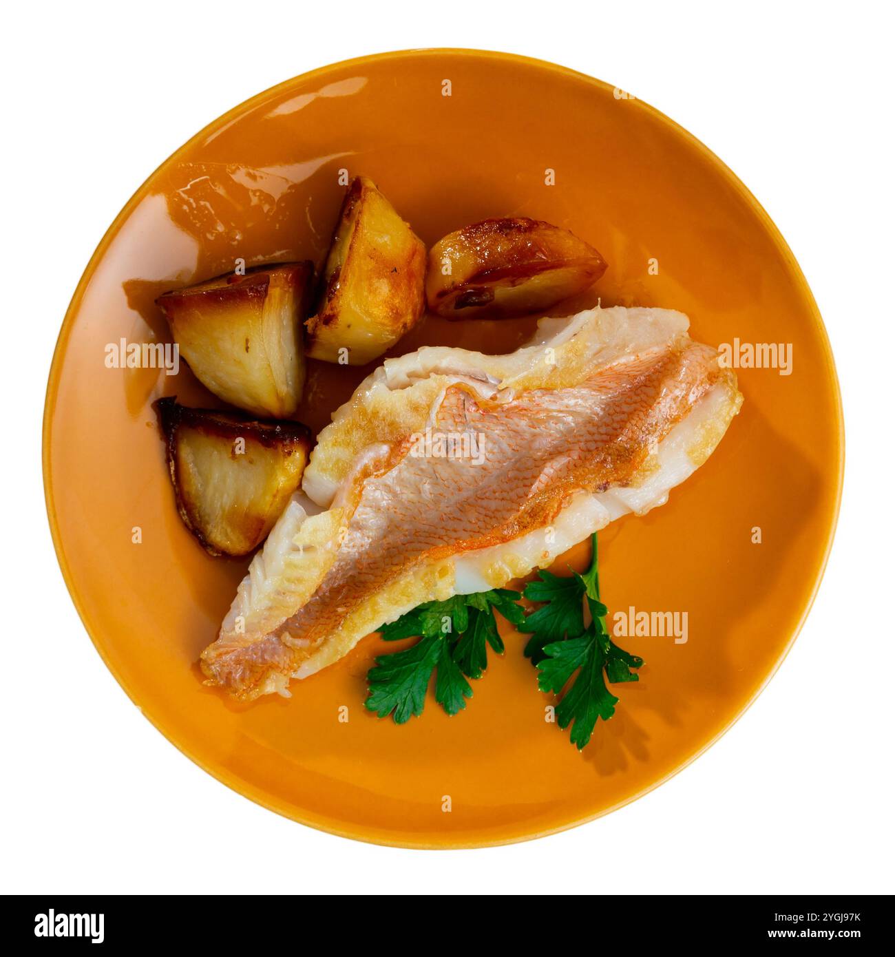 On plate, slice of fried redfish garnished with French fries Stock ...