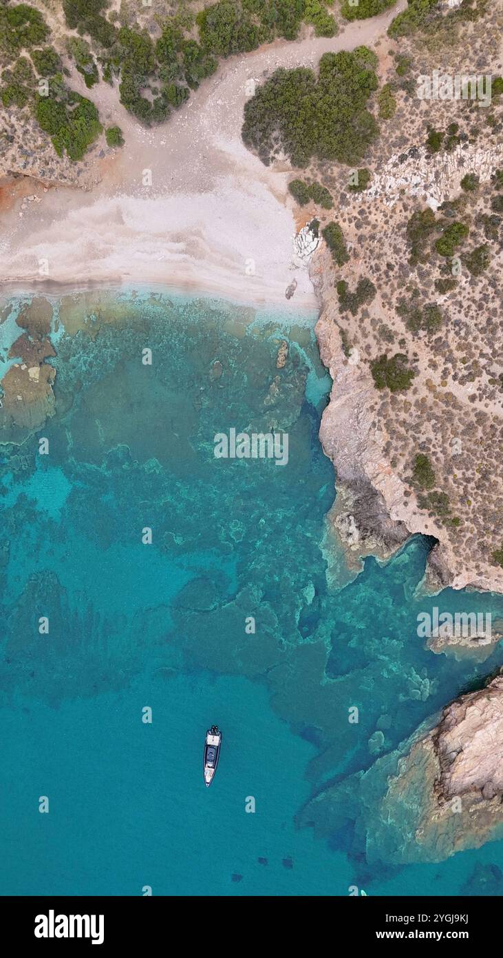 Aerial view of secluded Mediterranean cove with crystal-clear turquoise ...
