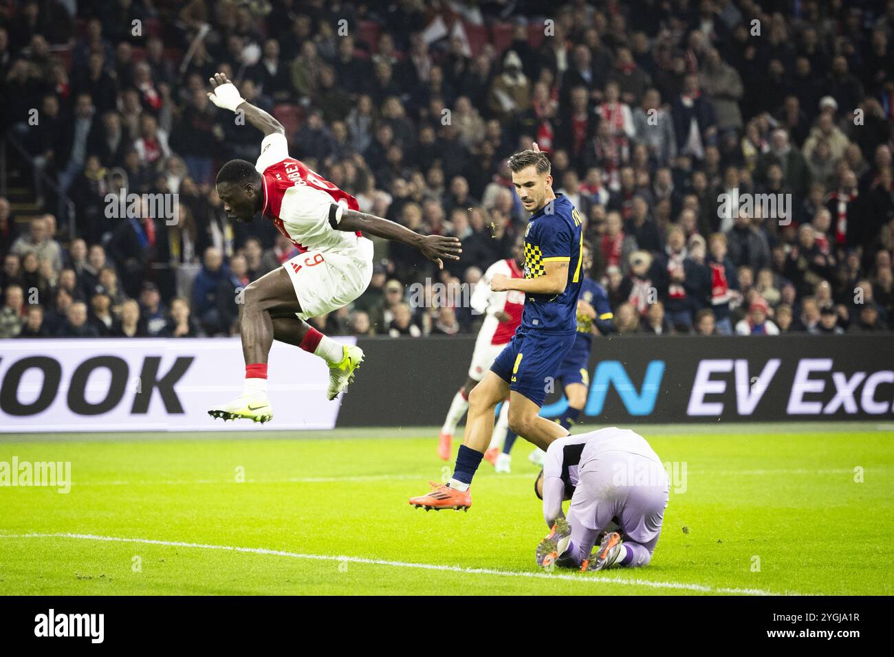 AMSTERDAM - (l-r) Brian Brobbey of Ajax, Nemanja Stojic of Maccabi Tel ...