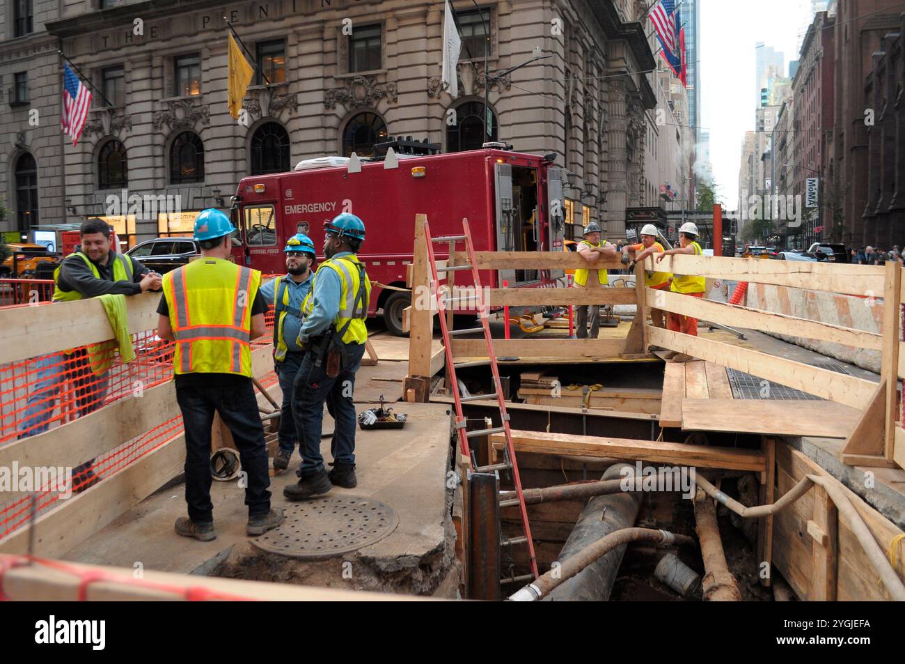 Construction workers work on the street in Manhattan, New York City ...