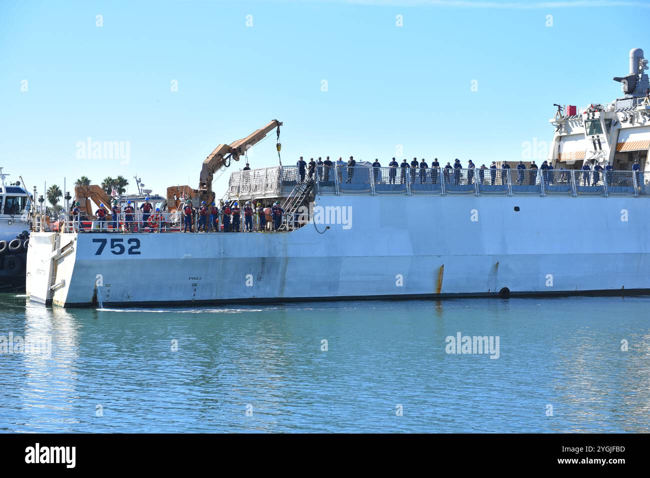 The crew of the Coast Guard Cutter Stratton (WMSL-752) stand at the ...