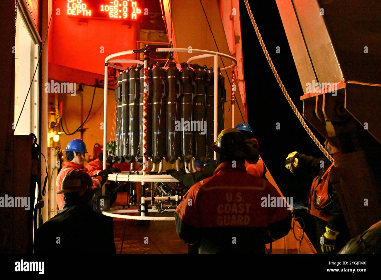 U.S. Coast Guard Cutter Healy (WAGB 20) crewmembers prepare to deploy a ...