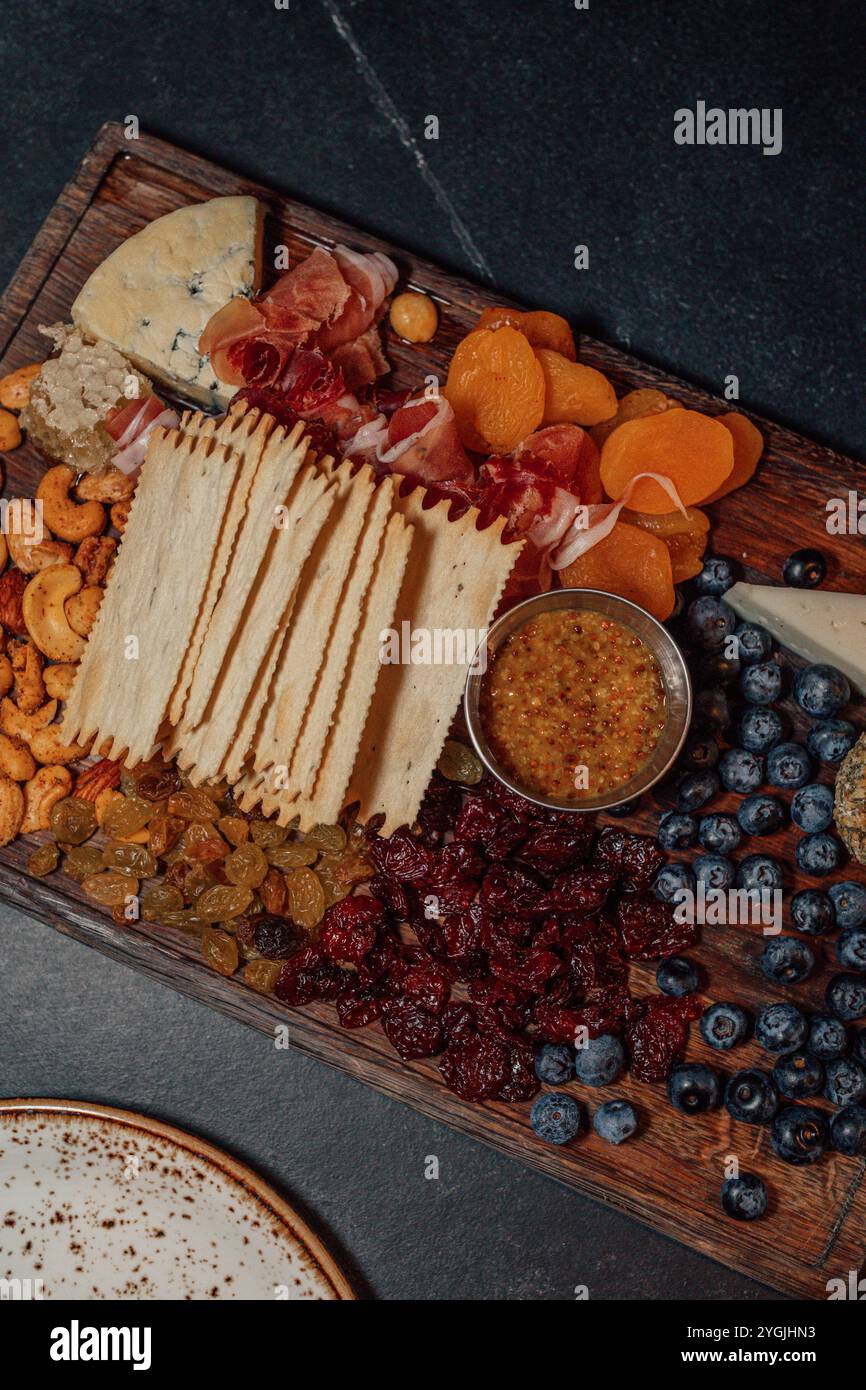 charcuterie snack board with dried fruits Stock Photo - Alamy