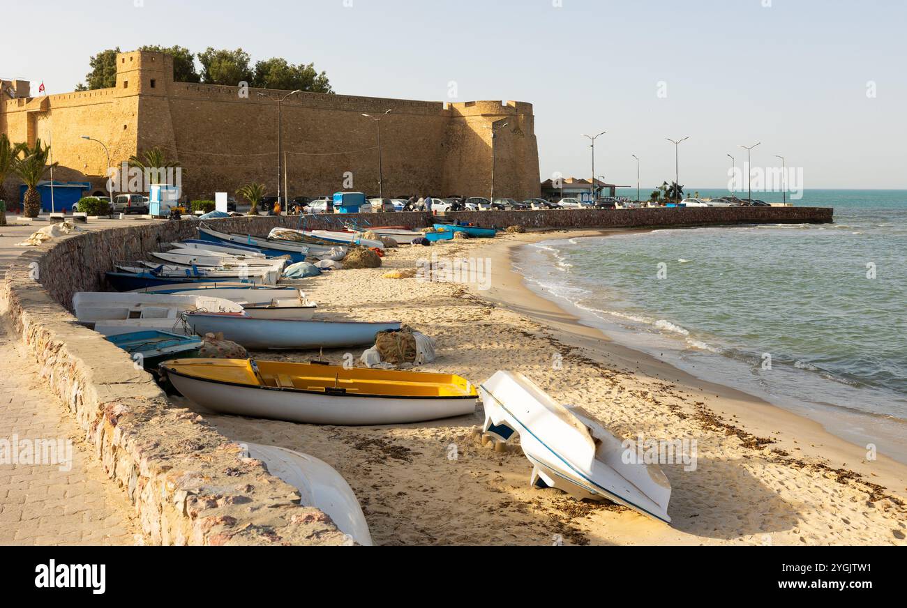 Mediterranean sea and outer stone wall of fort surrounding old medina ...