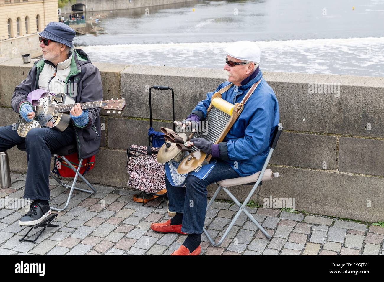 Male jazz quartet with musical instruments perform on the Charles ...