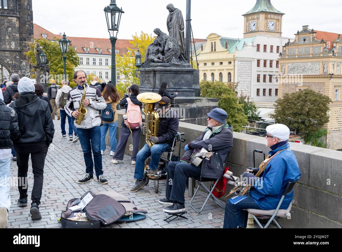 Male jazz quartet with musical instruments perform on the Charles ...