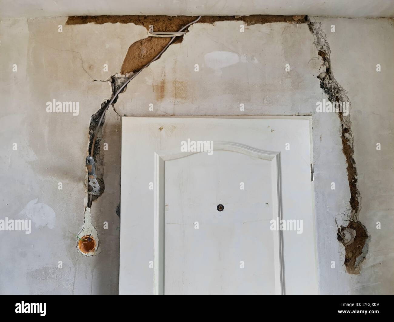 a wall was prised open to lay new power cables Stock Photo - Alamy