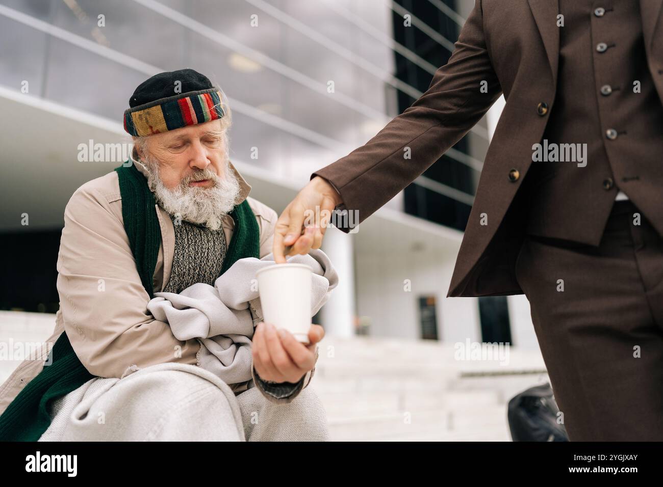 Homeless man sitting on steps hi-res stock photography and images - Alamy