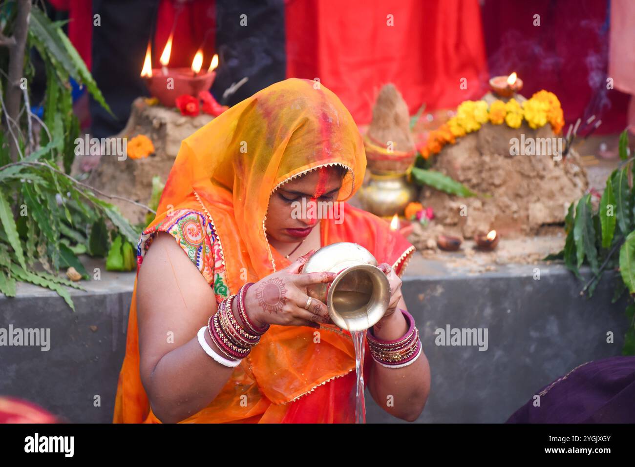 GURUGRAM, INDIA - NOVEMBER 7: Hindu devotees performing rituals to the ...