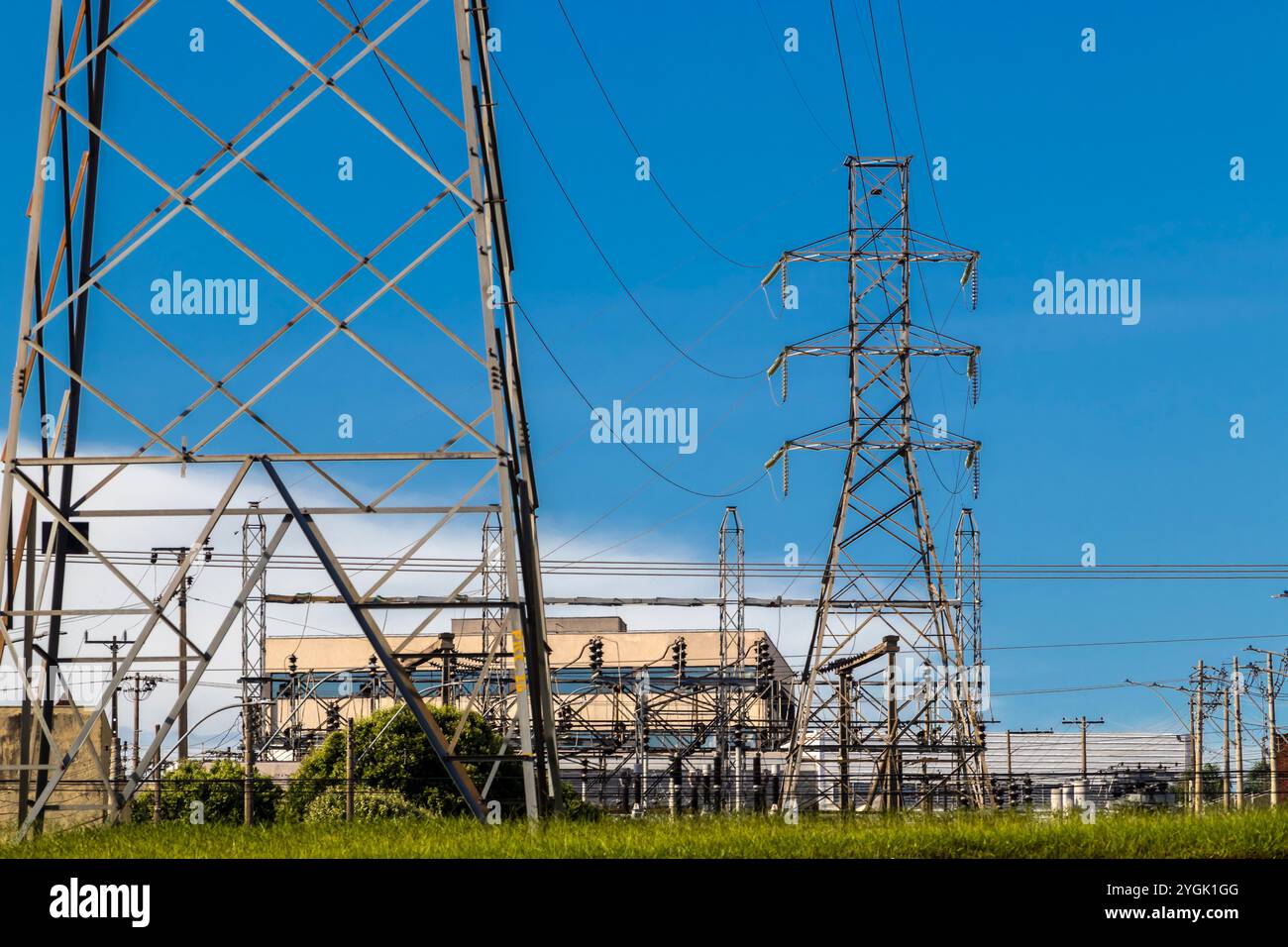 High voltage towers against blue sky background in Brazil Stock Photo ...