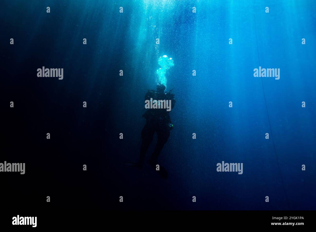 Deep Sea Diver with Sun Rays and Bubbles Underwater Stock Photo - Alamy