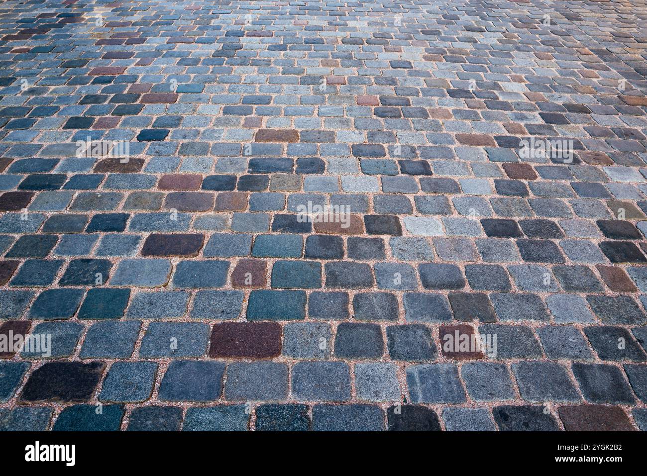 Pavement road. Background of bricks road. Stone cladding pavement ...
