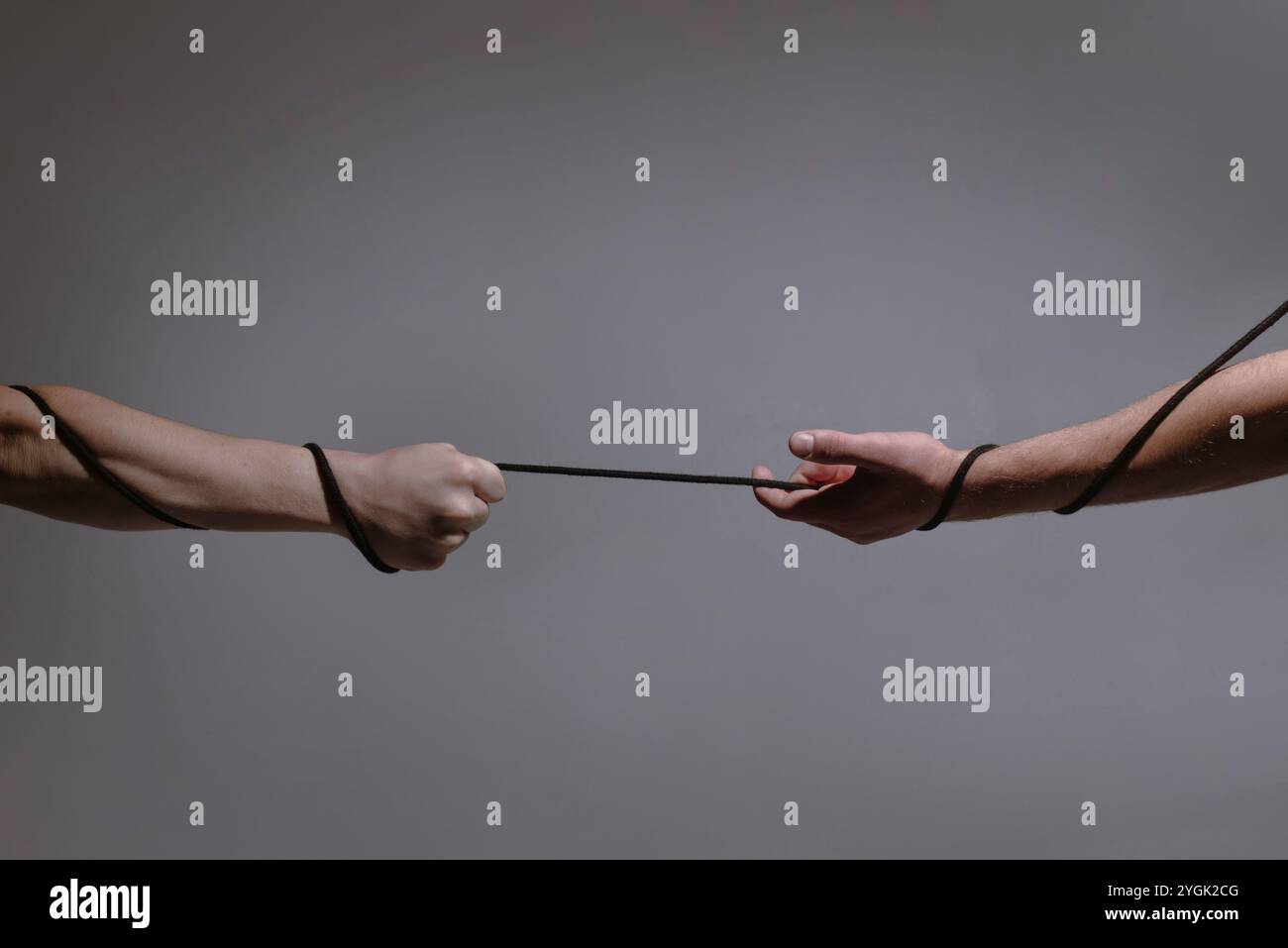 Rescue, help, helping gesture or hands. Conflict tug of war. Rope, cord. Hand holding a rope ...