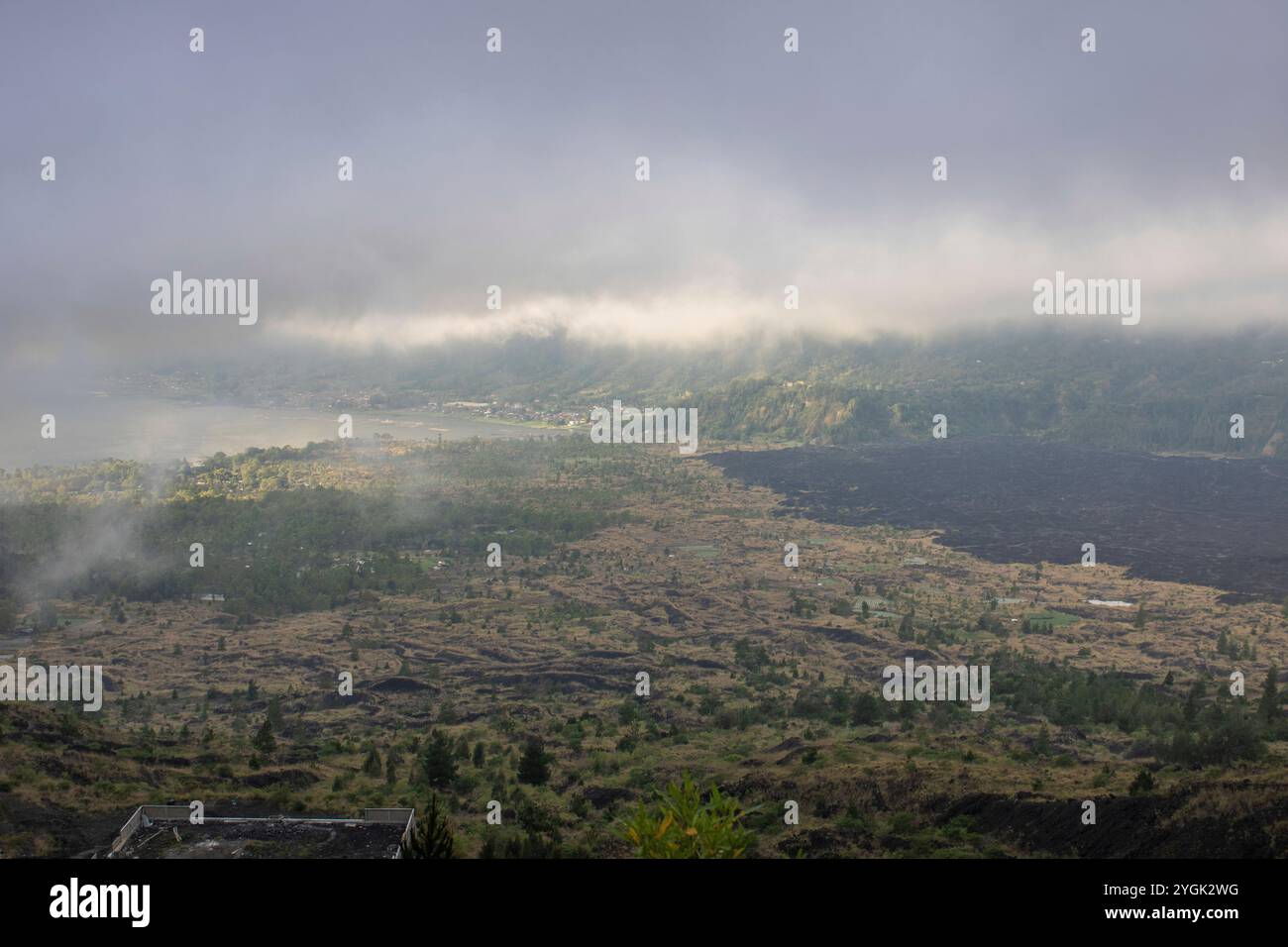 Fantastic sunrise on a volcano. View upwards and in the clouds to the ...