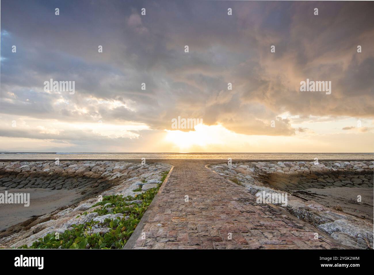 Fantastic sunrise on the beach with small temples and built as ...