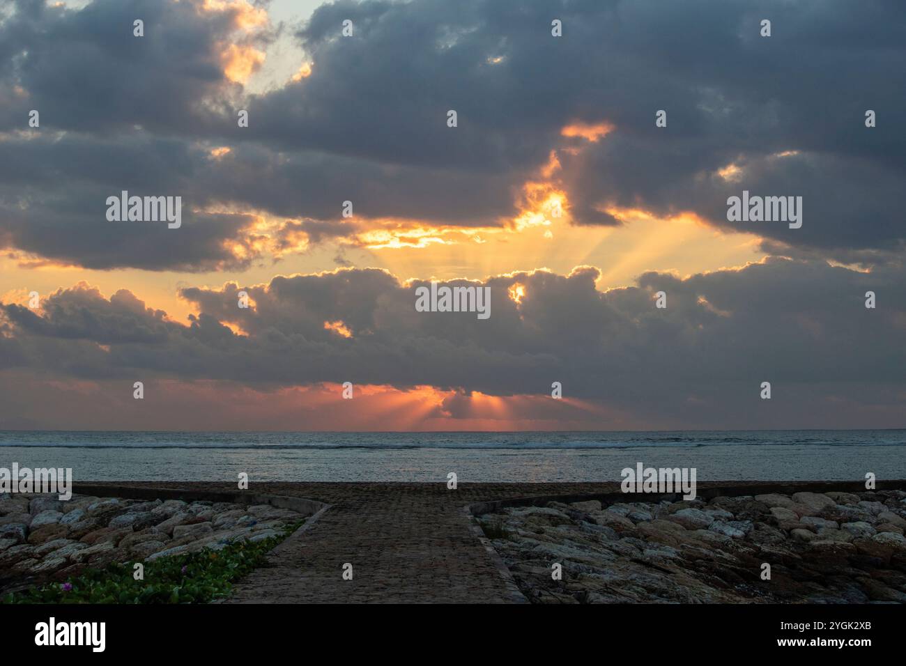 Fantastic sunrise on the beach with small temples and built as ...