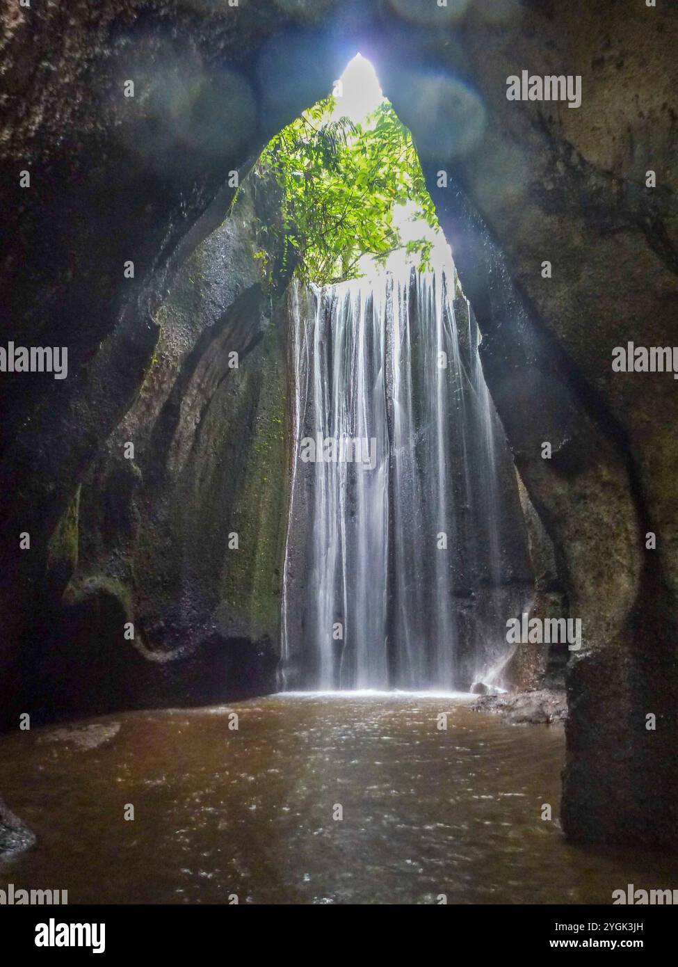 Waterfall in a natural tropical canyon. Beautiful hidden river and ...