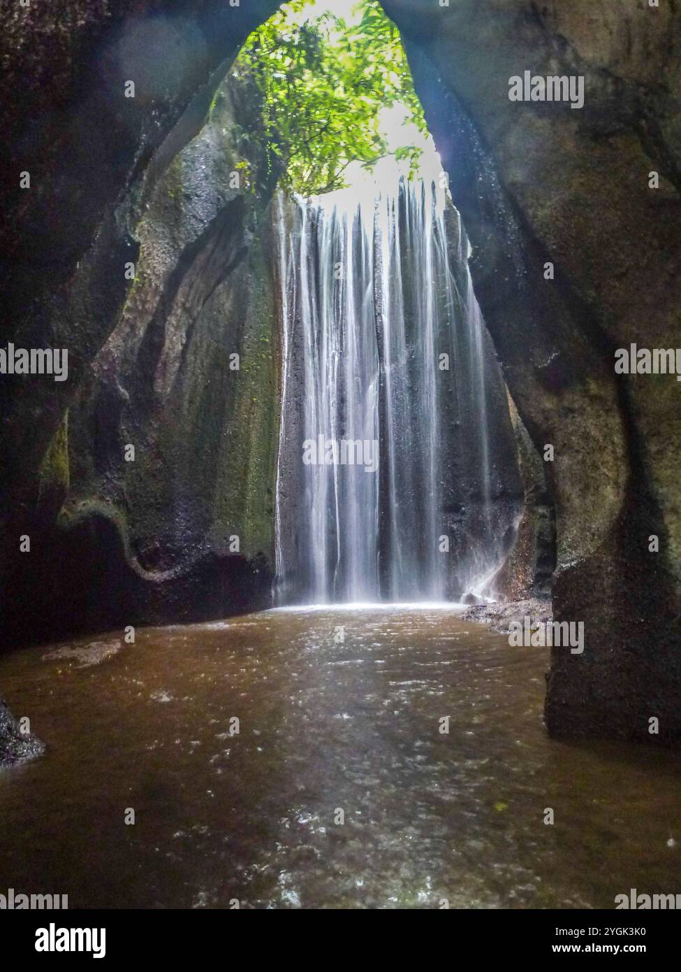 Waterfall in a natural tropical canyon. Beautiful hidden river and ...