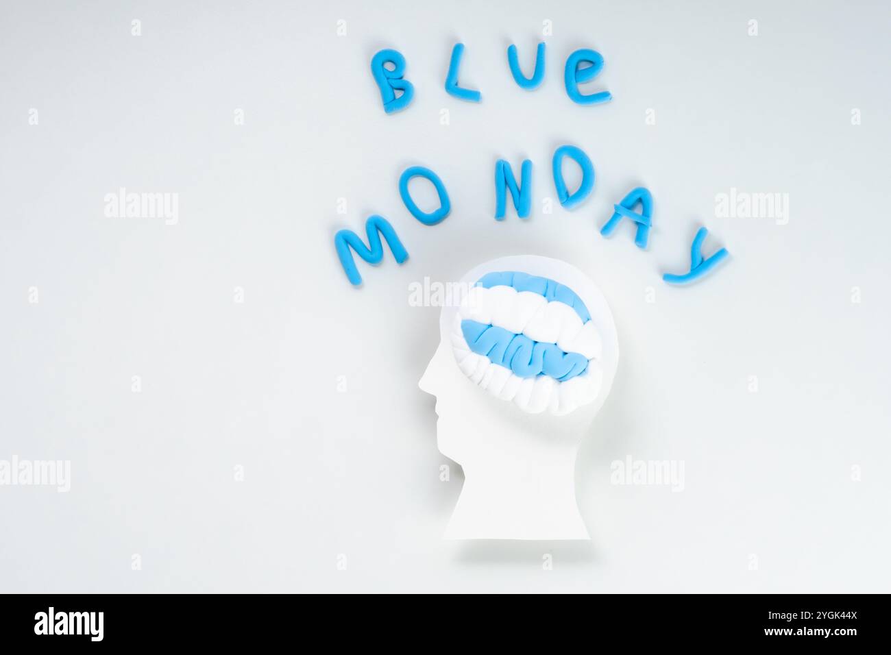 Silhouette of a human head with blue brain white background. Seasonal ...