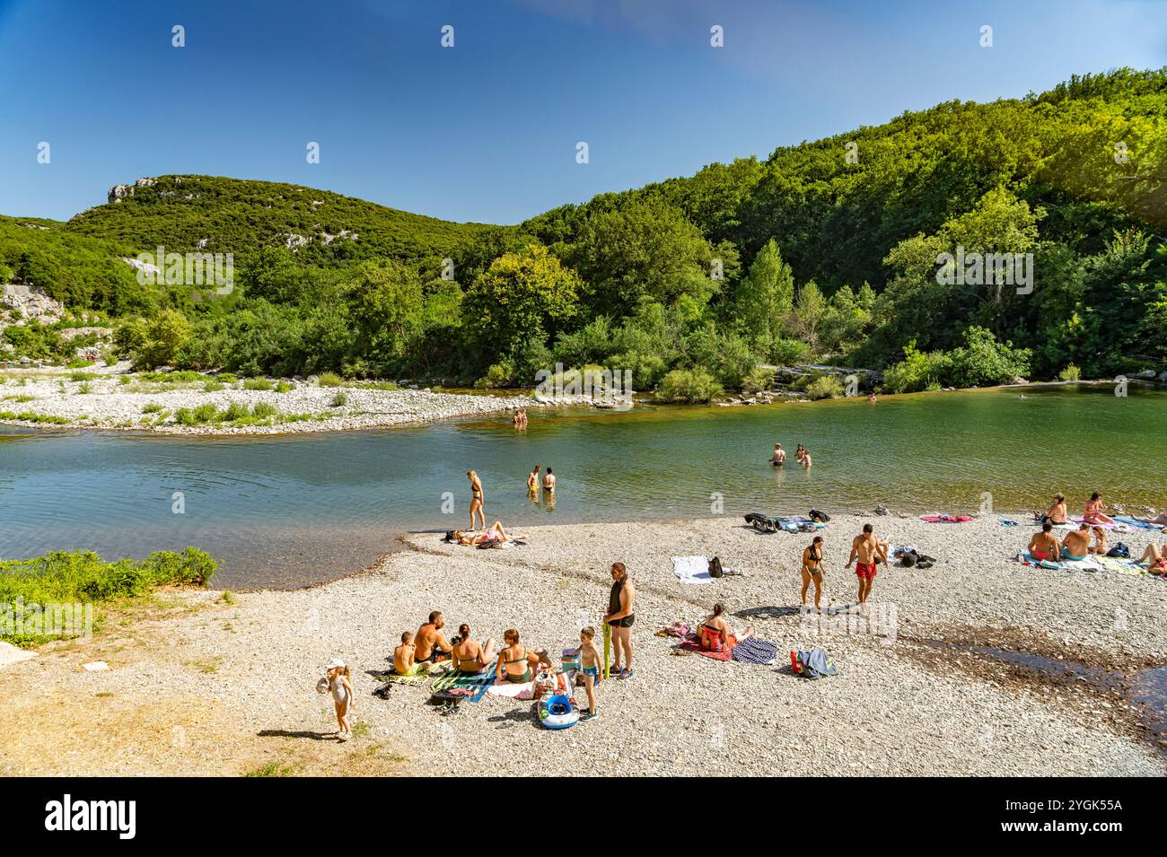 People bathing on the beach of the river Herault near Laroque, France ...
