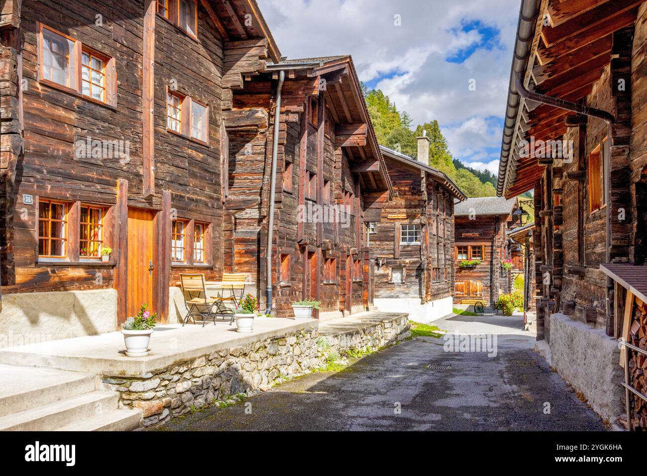 Typical traditional wooden houses in the Valais village of Ulrichen in ...