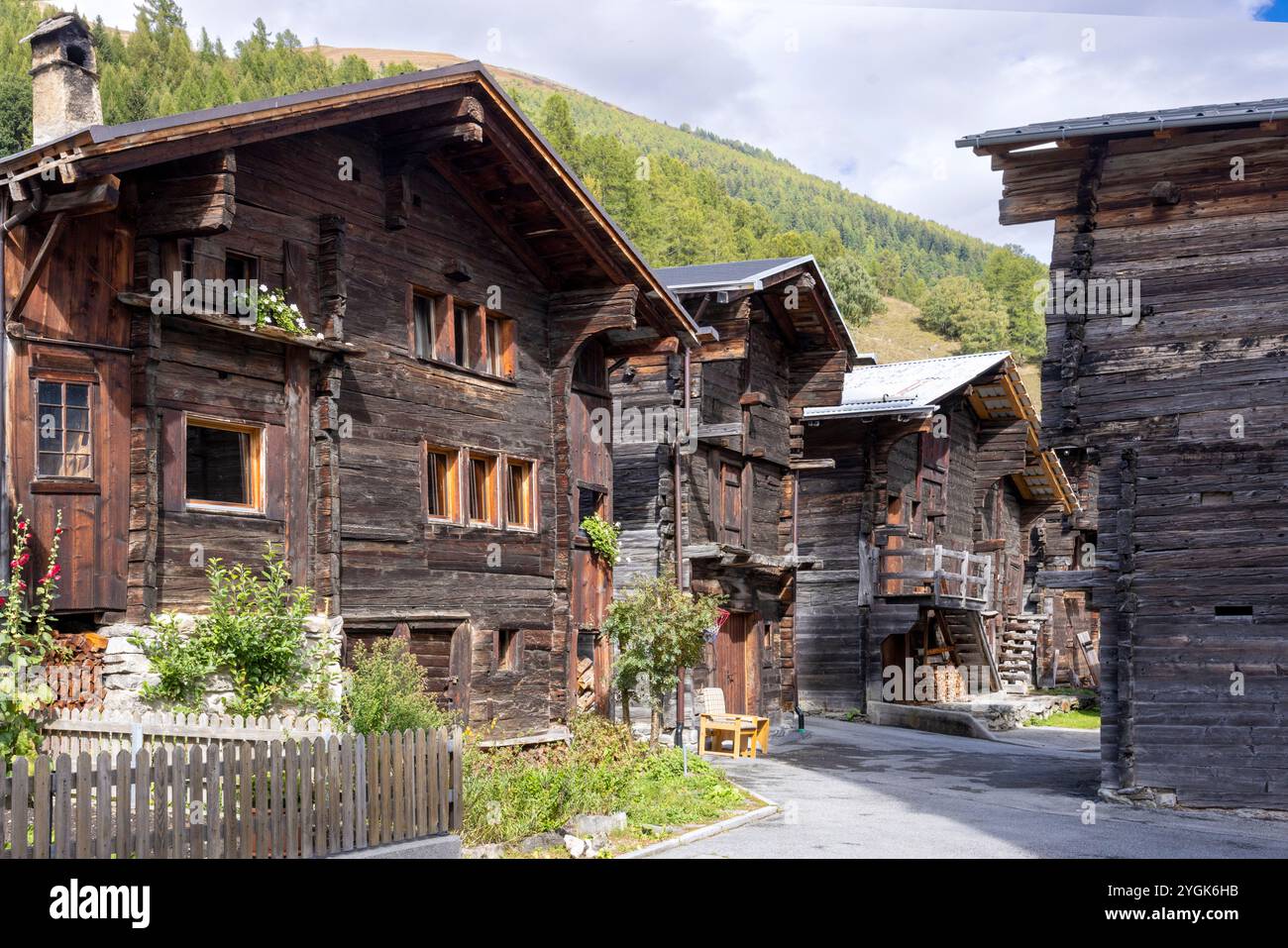 Typical traditional wooden houses in the Valais village of Ulrichen in ...
