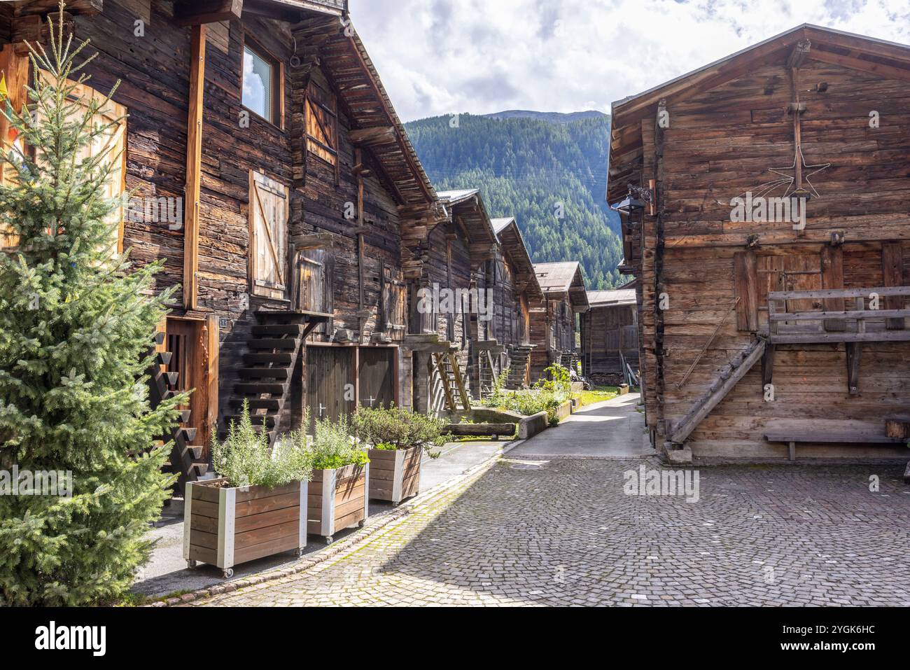 Typical traditional wooden houses in the Valais village of Ulrichen in ...