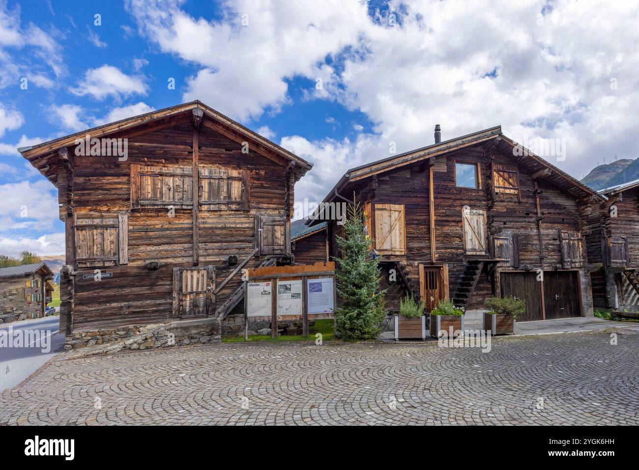 Typical traditional wooden houses in the Valais village of Ulrichen in ...