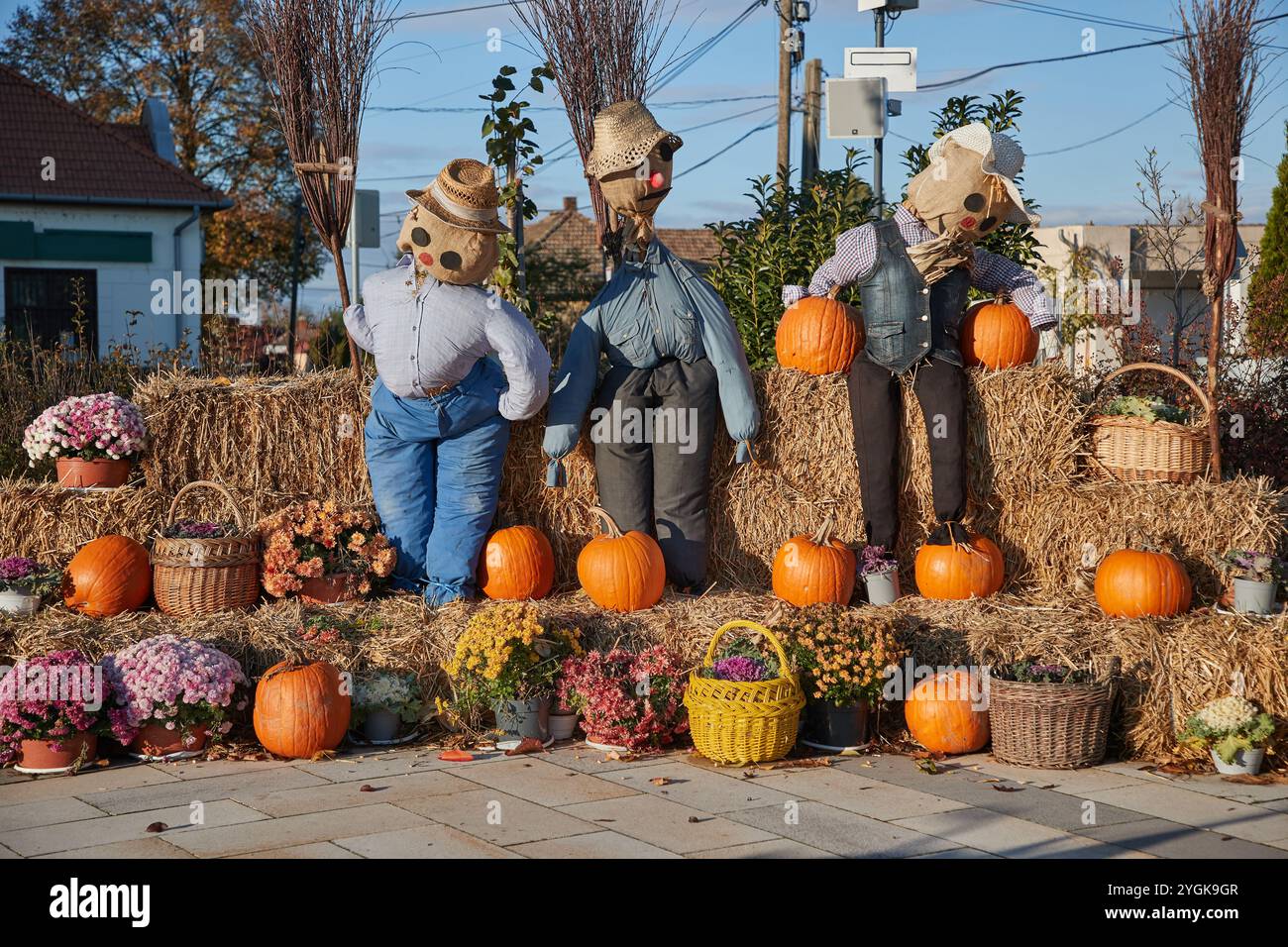 Halloween installation on a town square with pumpkins and puppets Stock ...